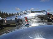 polished aluminum aircraft skin, with rivets and stress deformations ...